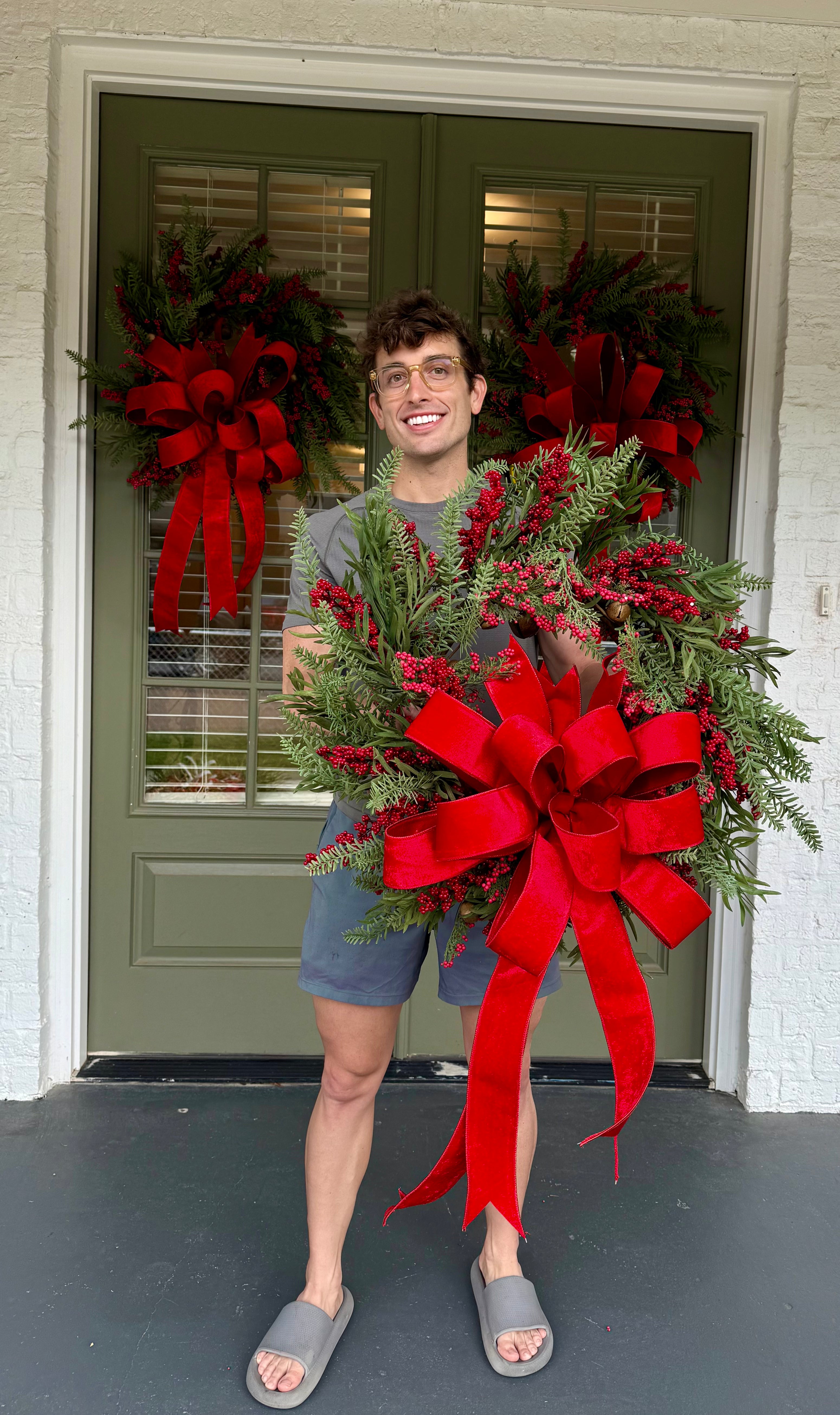 Jingle bell and faux berry wreath. Tied with a JME red velvet bow. Abo – John Mark's